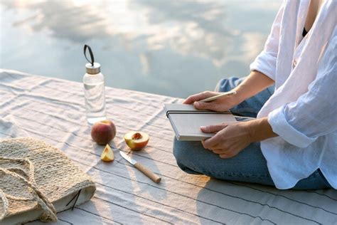 Premium Photo Summer Picnic By The Lake At Sunset Woman Relaxes In Nature