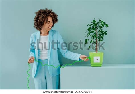 Smiling Woman Inserting Plug Socket Attached Stock Photo Shutterstock
