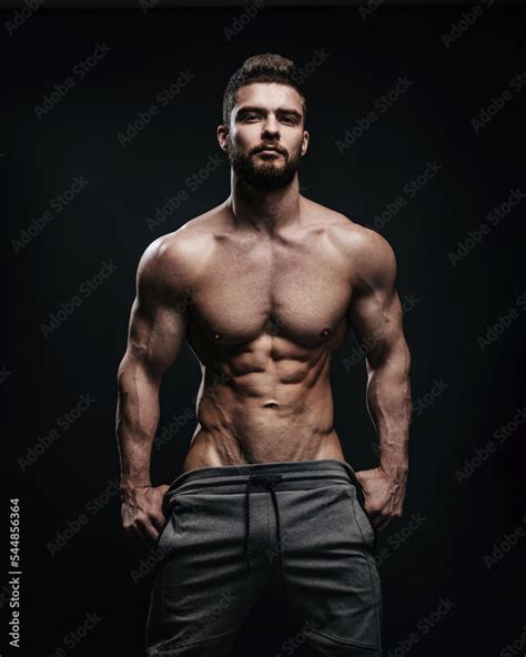 Slim Muscular Male Model At Black Background Fitness Shirtless Guy In