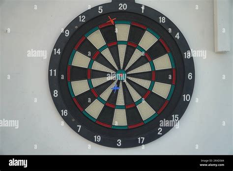 Dart Board On White Wall Background The Dart Hit The Center Of The