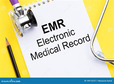 EMR Electronic Medical Record Text Concept Written On Notepad With Stethoscope Stock Image