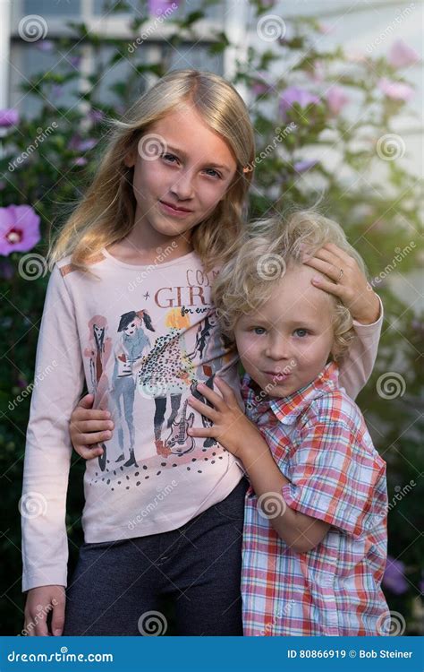 Young Brother And Sister Using Their Computer Laptop Together Stock Image