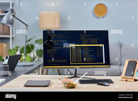 Background Image Of Software Programming Workplace At Home Office With Code On Computer Screen