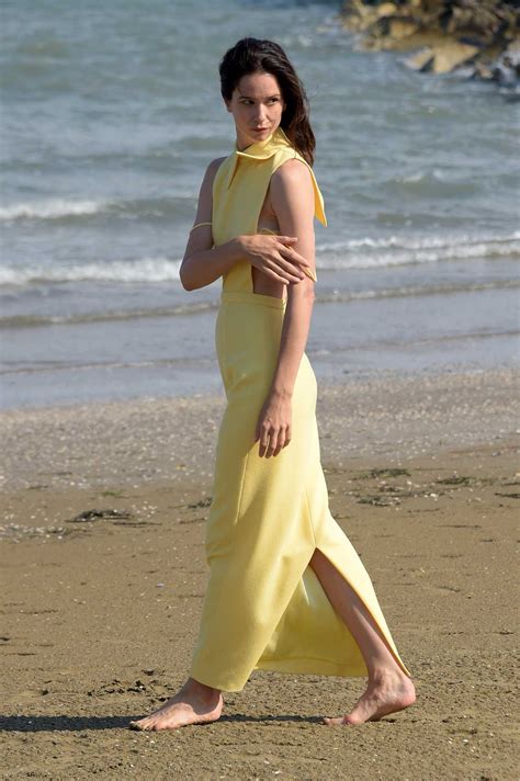 Katherine Waterston In A Yellow Dress Poses For Photoshoot On The Beach