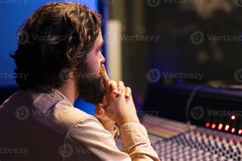 Music Engineer Working On Mixing And Mastering Tunes With Digital