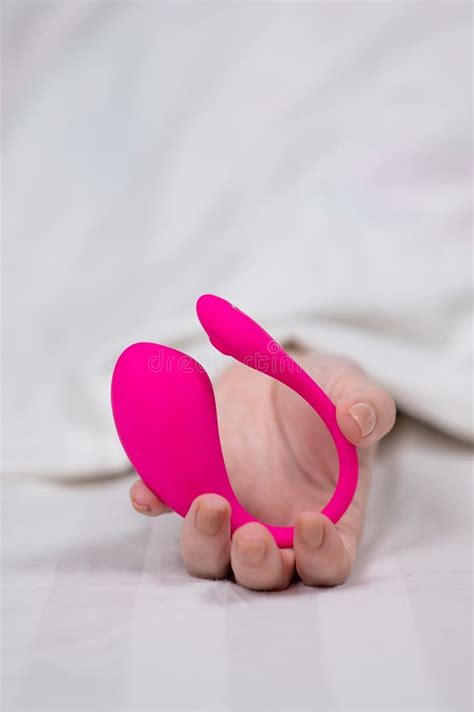 Woman Holding Curved Pink Vibrator While Lying In Bed Stock Photo Image Of Passion Indoor