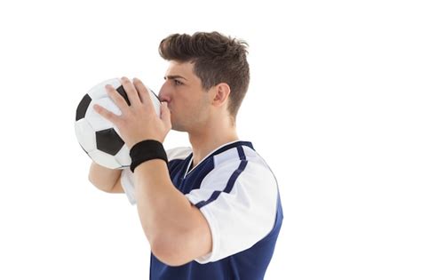 Premium Photo Side View Of A Football Player Kissing Ball