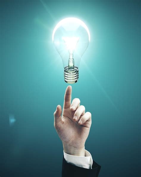 Premium Photo Hand Pointing To Light Bulb
