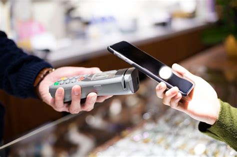 Premium Photo Woman Using Nfc Technology To Make Payment