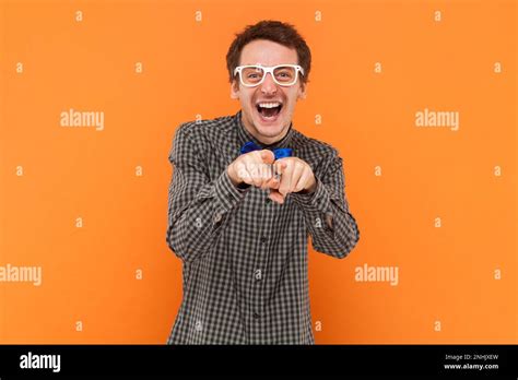 Overjoyed Man Nerd Laughs At Something Funny Points Directly Into Camera Expresses Good