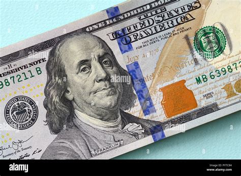Us Dollar Bills Of A New Design With A Blue Stripe In The Middle Is