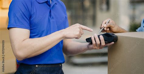 Asian Delivery Man Hand Using Smart Phone To Scan QR Code On Tag Concept Of Parcel Delivery