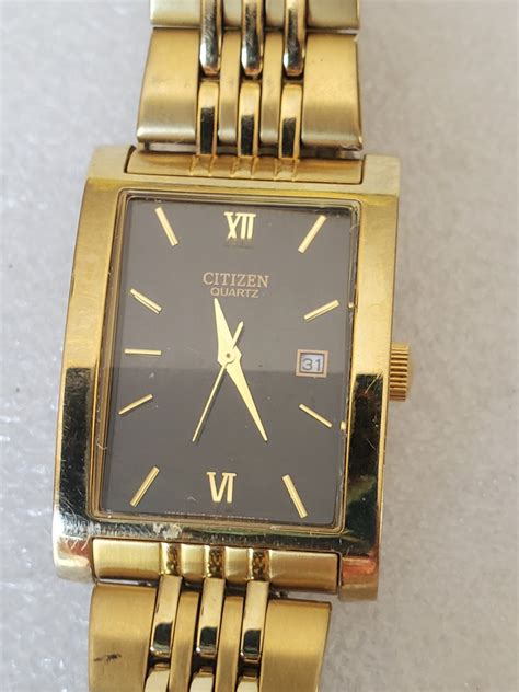 Vintage Mens Gold Tone Citizen Quartz Watch With Date Slot N Rectangular Shaped W Black Face