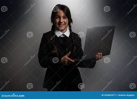 A Girl In A Black Dress Wednesday Girl With A Laptop Stock Image