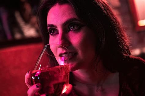 Premium Photo Happy Brunette Rebel Girl Sipping Drink On Vintage