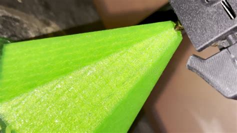 Precision In Progress Close Up Of A 3d Printer Creating A Bright Green