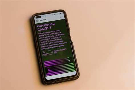openai website with introduction to chatgpt on computer monitor · free