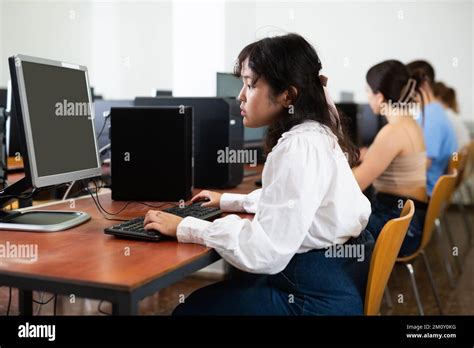 Schoolgirl Learning Basics Of Programming In Group Course In Computer College Stock Photo Alamy
