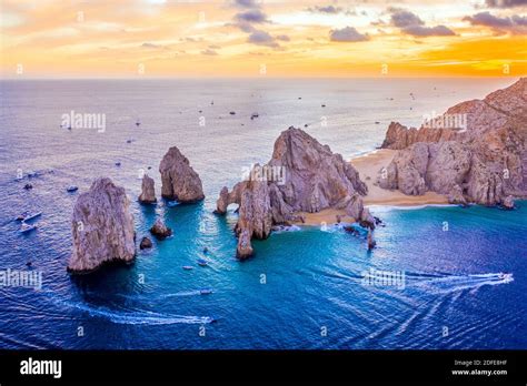Aerial View Of Boats Speeding By El Arco De Cabo San Lucas Mexico At