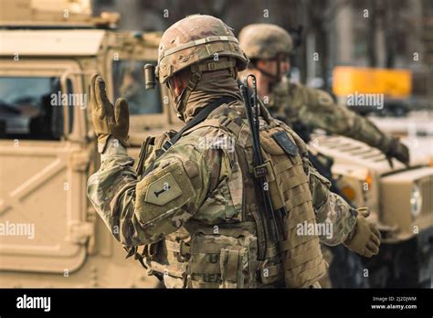 United States Marine Corps Soldiers With Shotguns Or Rifles Helmets And Armored Vehicles Humvee
