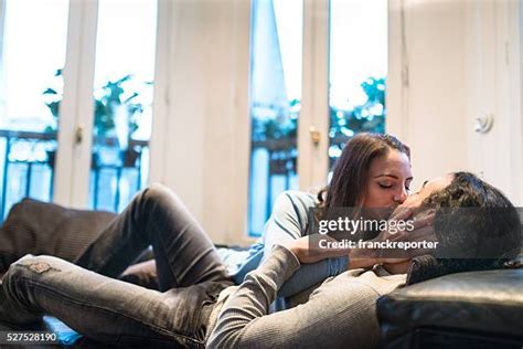 Young Couple Making Out On Couch Photos And Premium High Res Pictures