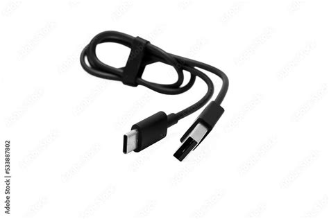 Black USB Cable With Plugs Type A And Type C At The Edges On A White Background Stock Photo