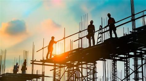 premium photo a construction site with workers coordinating to build