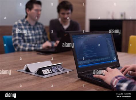 Software Developer Writing Programming Code On Laptop Computer Stock Photo Alamy