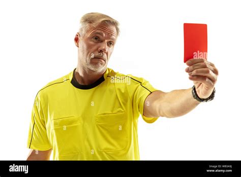 Referee Showing A Red Card To A Displeased Football Or Soccer Player