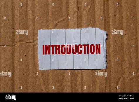 Introduction Message Written On Ripped Torn Paper With Cardboard