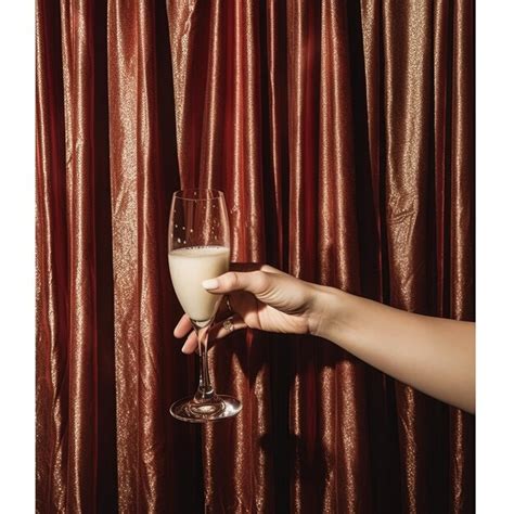 Premium Photo A Person Holding A Glass Of Wine With A Wine Glass In It