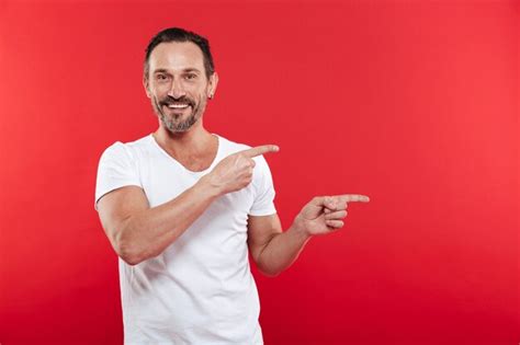 Premium Photo Cheerful Adult Man Pointing