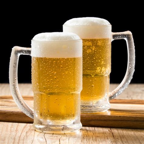 Premium Photo Two Draft Beer Mug On A Wooden Table