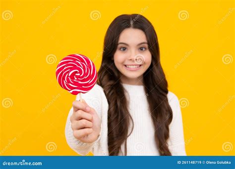 Teen Girl Hold Lollipop Caramel On Yellow Background Candy Shop
