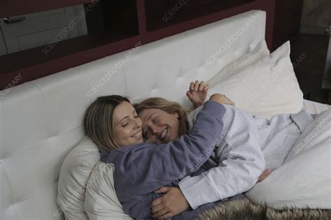 Lesbian Couple Embracing In Bed Stock Image F0434968 Science Photo Library