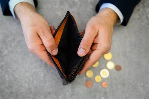 Premium Photo Man Looking Into Empty Wallet