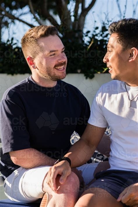 Image Of Two Gay Men Sitting Outdoors In The Sunshine Austockphoto