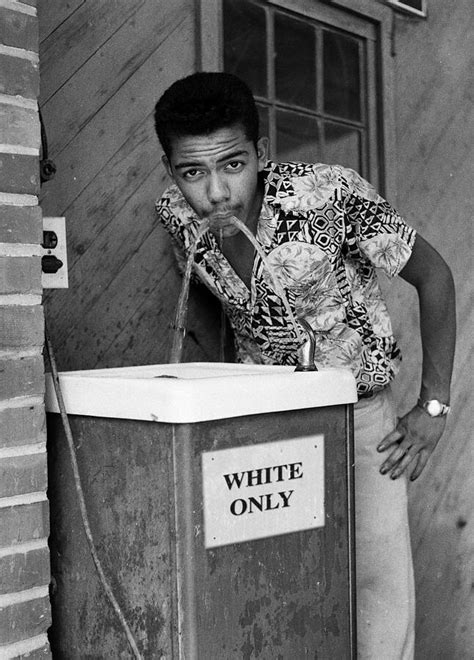 Cecil Williams Drinking Out Of A White By Claflin University