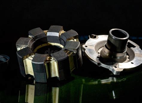 Details And Components Of The Stator Of The Refrigeration Unit On A Black Background Close Up