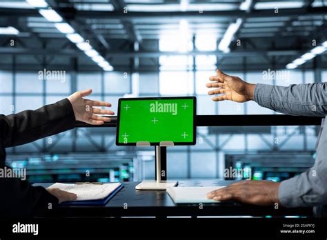 technicians in data center using chroma key green screen tablet refining server virtualization