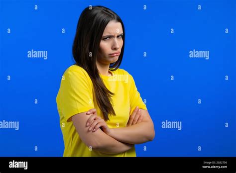 Angry Offended Woman Keeping Arms Crossed And Staring At Camera With Sceptical Look Feeling Mad