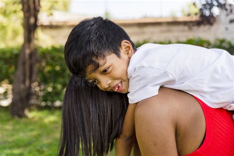 Happy Mother And Son Enjoying Together Outdoors In A Park Stock Image