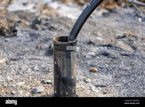 Casing Pipe With Polyethylene Ground Loop Pipes In The Process Of Being Installed In A New