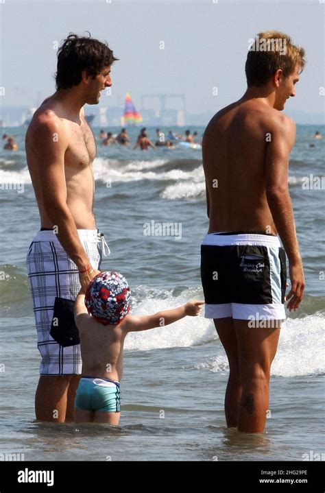 Football Player Diego Milito Spending A Day On The Beach With His Son Leandro And Wife Sofia At