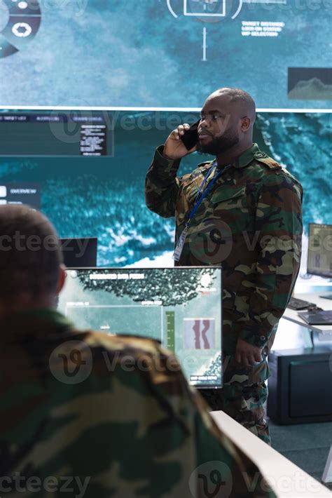 Military Supervisor Transmitting Intelligence Via Phone Call In Army Base Of Operations Working