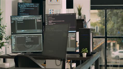 Computer Screens On Desk Running Programming Code Data Algorithms Stock