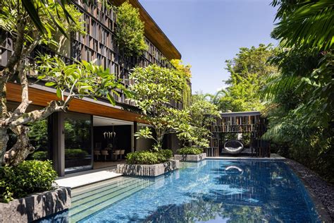Plant Filled Timber Lattice Wraps Around Walls Of Singapore Home