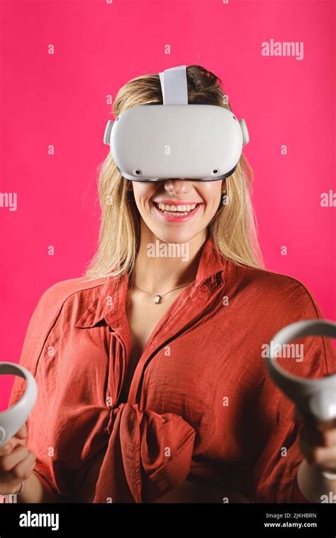 A Vertical Shot Of A Blonde Caucasian Girl Wearing Vr Glasses Against A