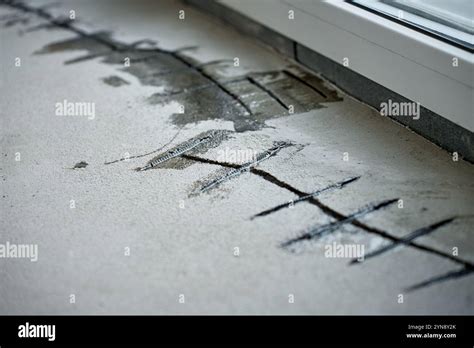 Repairing Cracks In Concrete Floor Near Window Using Sealant