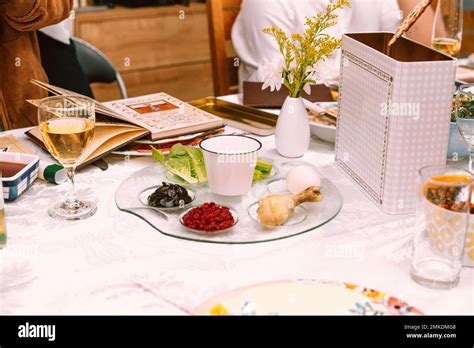 Passover Table Setting With A Traditional Passover Seder Plate With Symbolic Meal Matzah And